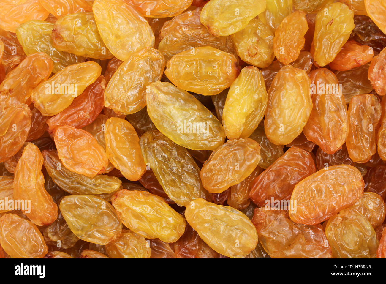 Heap of Golden Jumbo raisins. Background. Closeup Stock Photo - Alamy