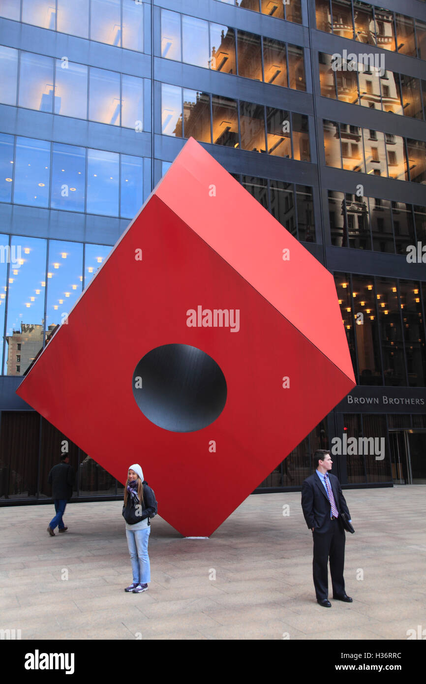 People in front of the Red Cube,a steel sculpture by Isamu Noguchi in ...