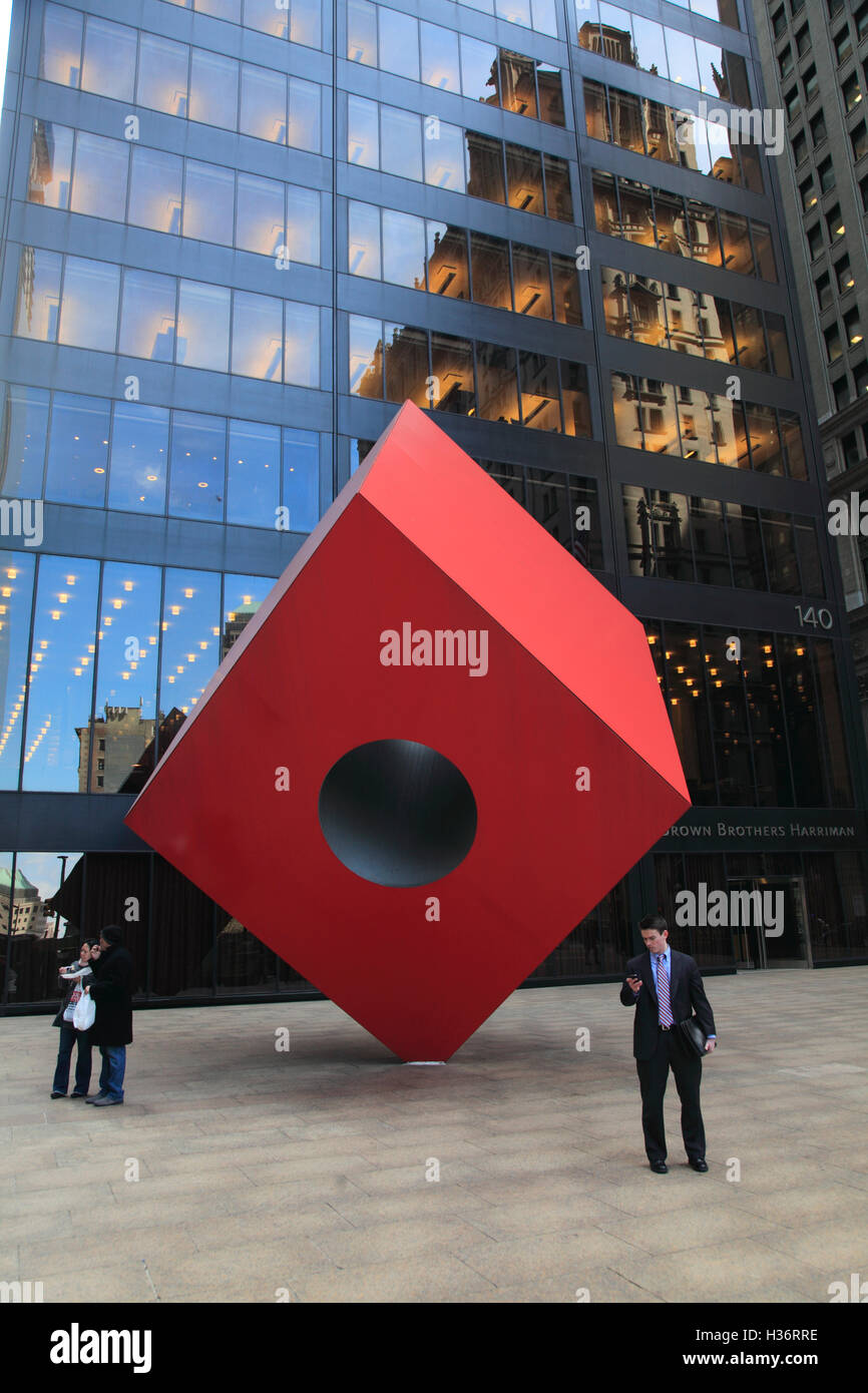 People in front of the Red Cube,a steel sculpture by Isamu Noguchi in ...