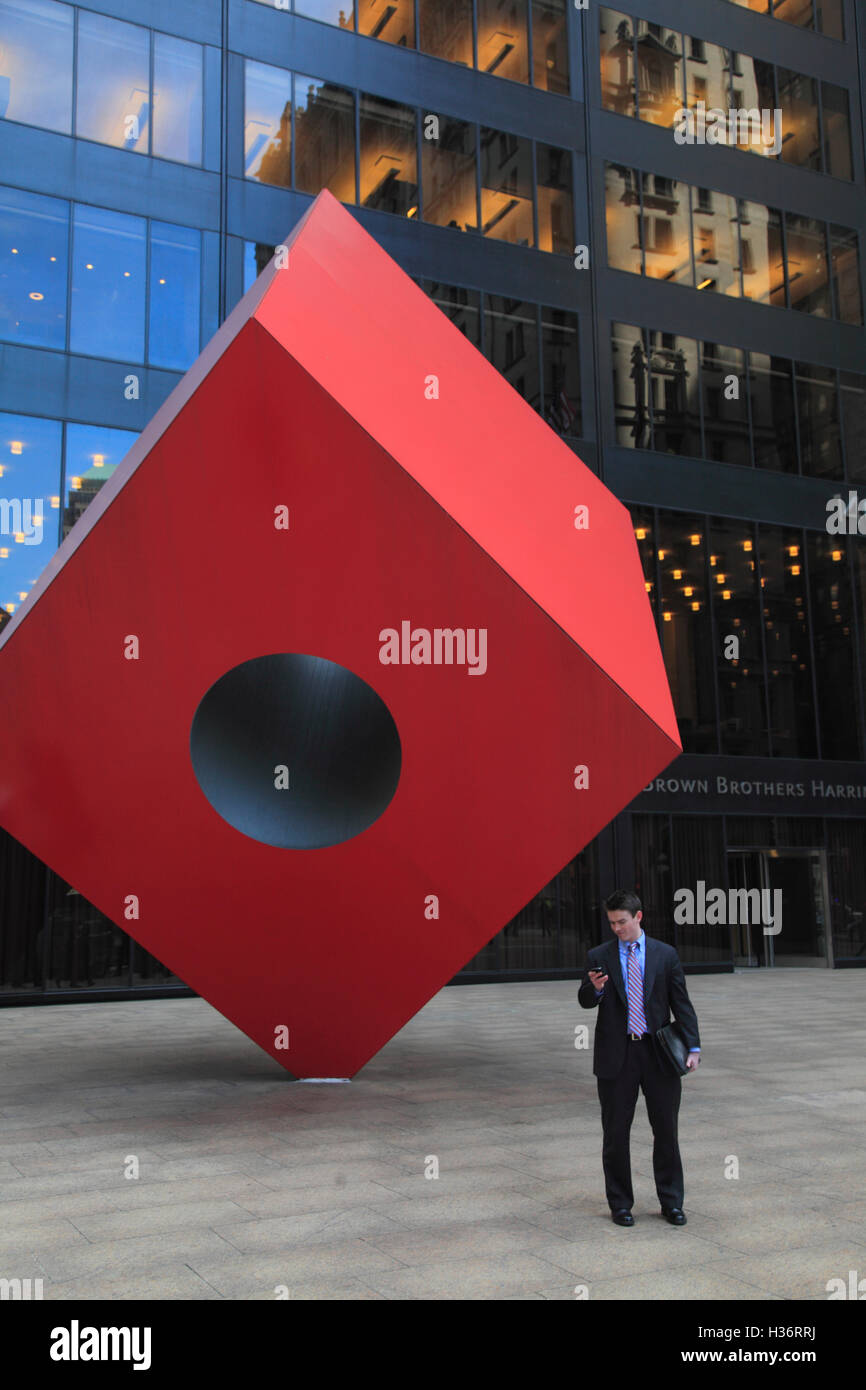 People in front of the Red Cube,a steel sculpture by Isamu Noguchi in ...