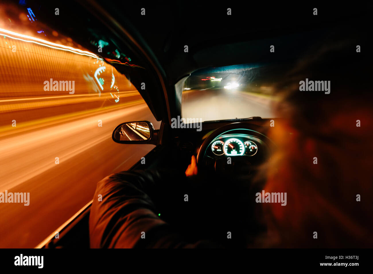 Driving at night Stock Photo - Alamy