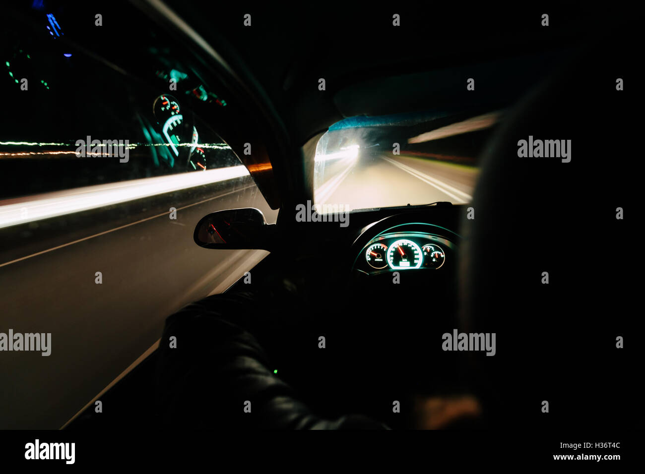 Driving at night Stock Photo - Alamy