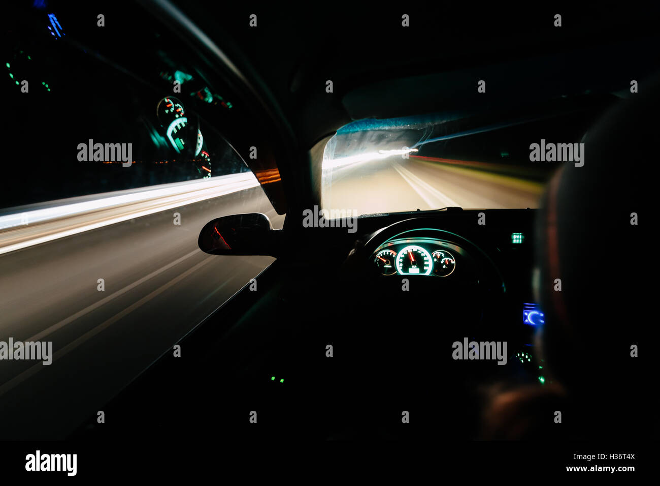 Driving at night Stock Photo - Alamy
