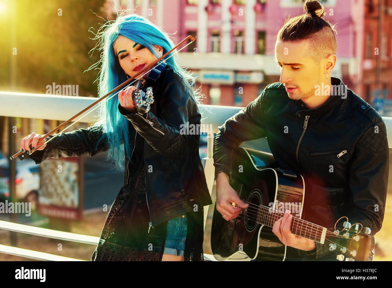 Music street performers with girl violinist sunset cityscape Stock ...