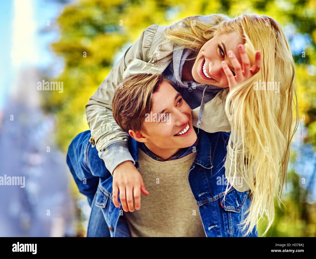 Young couple hugging and flirting in park Stock Photo - Alamy