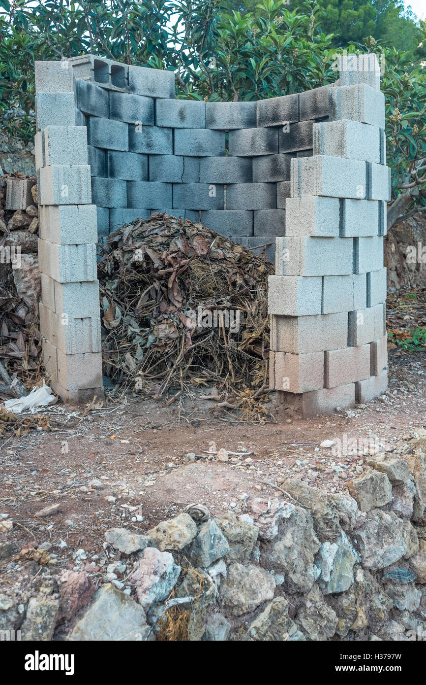 Concrete structure in a field used as burner for agricultural pruning ...