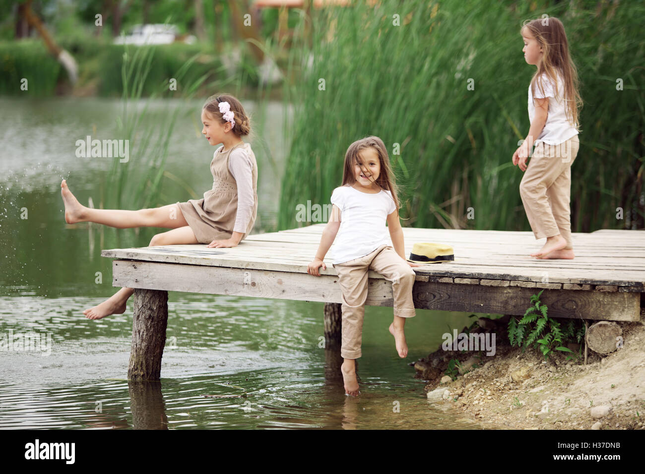 Children near pond Stock Photo - Alamy
