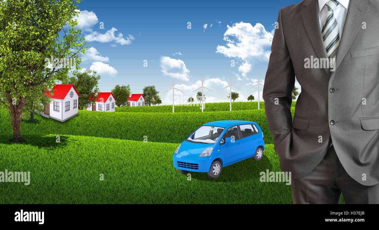 Businessman and green landscape as backdrop Stock Photo - Alamy