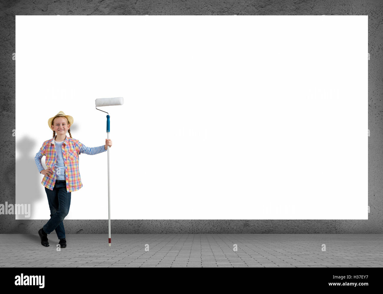 girl with roller stands near the wall Stock Photo - Alamy