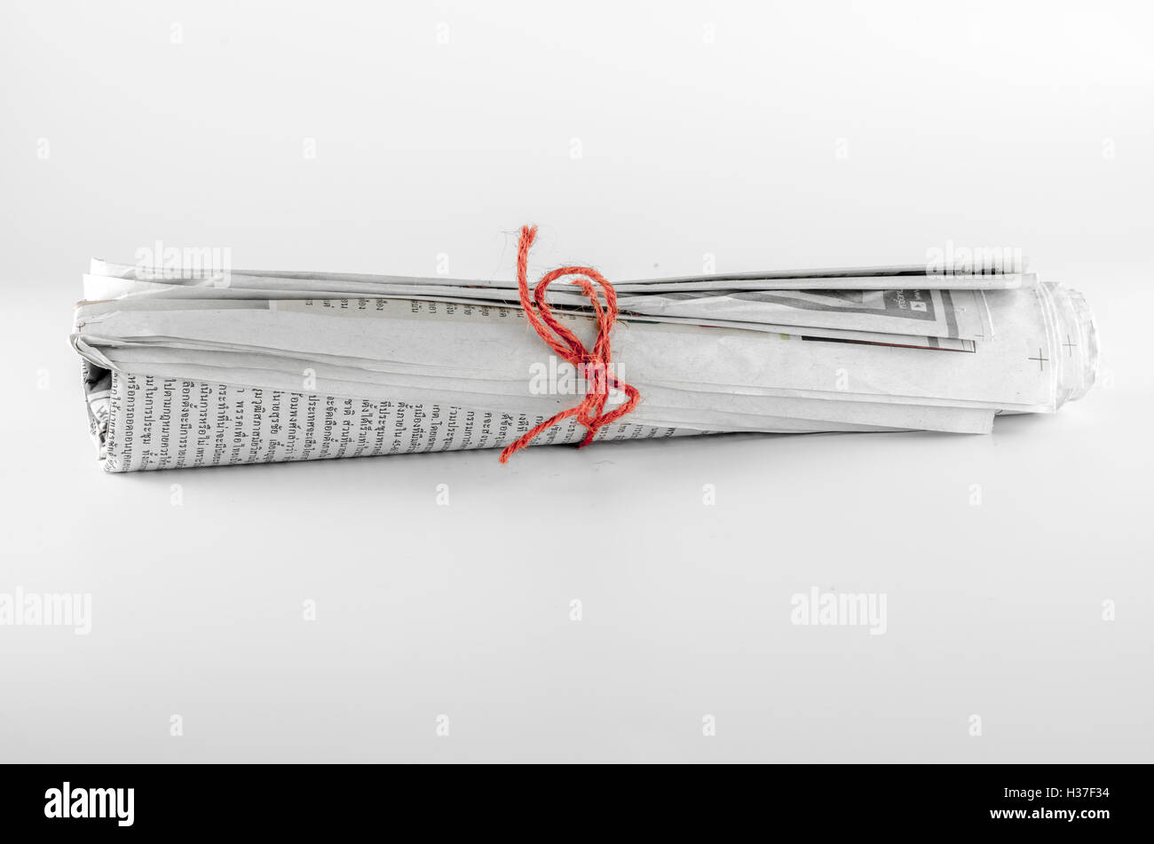 Detail rolled up newspaper hi-res stock photography and images - Alamy