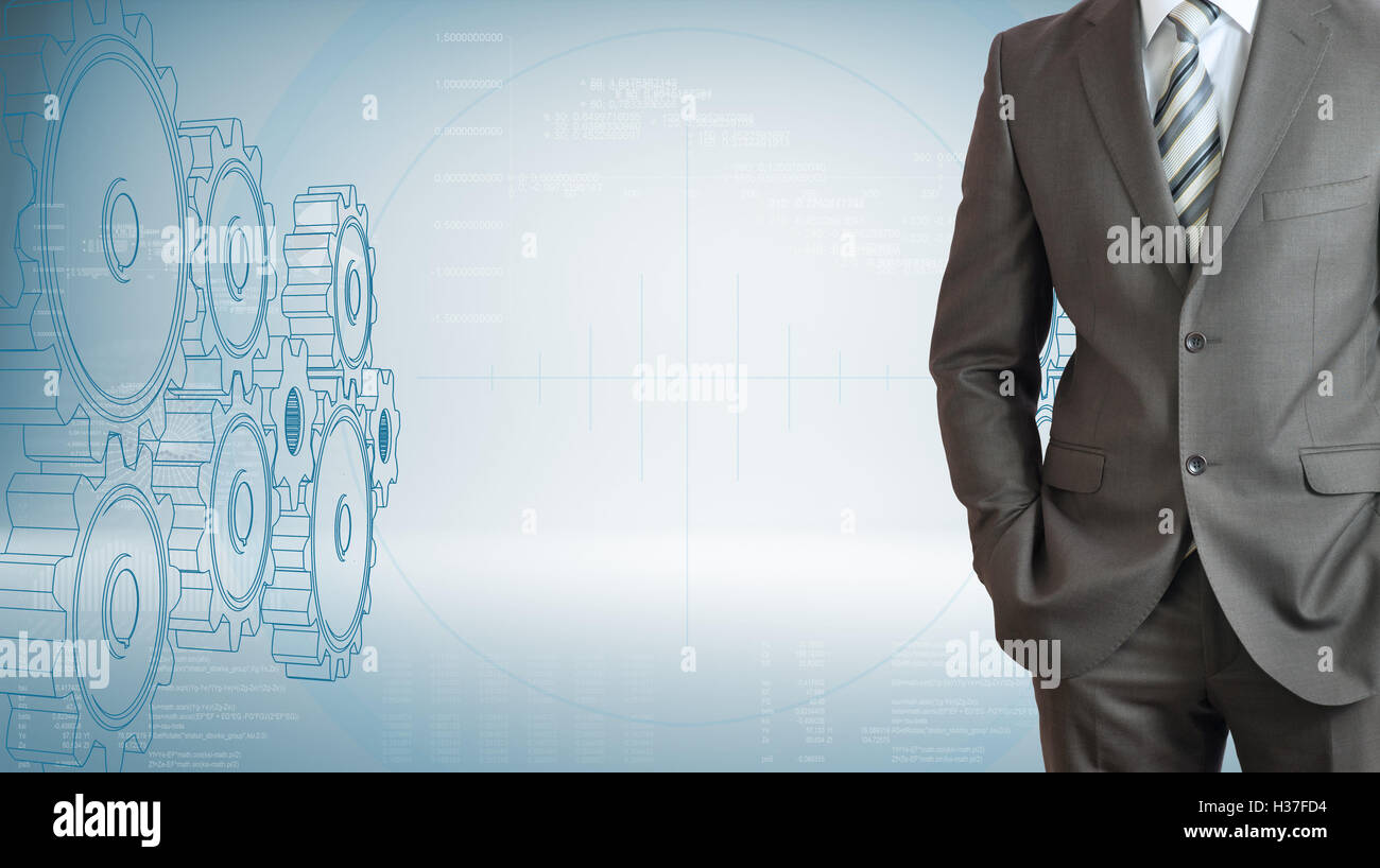 Businessman with high-tech gears and graphs Stock Photo - Alamy