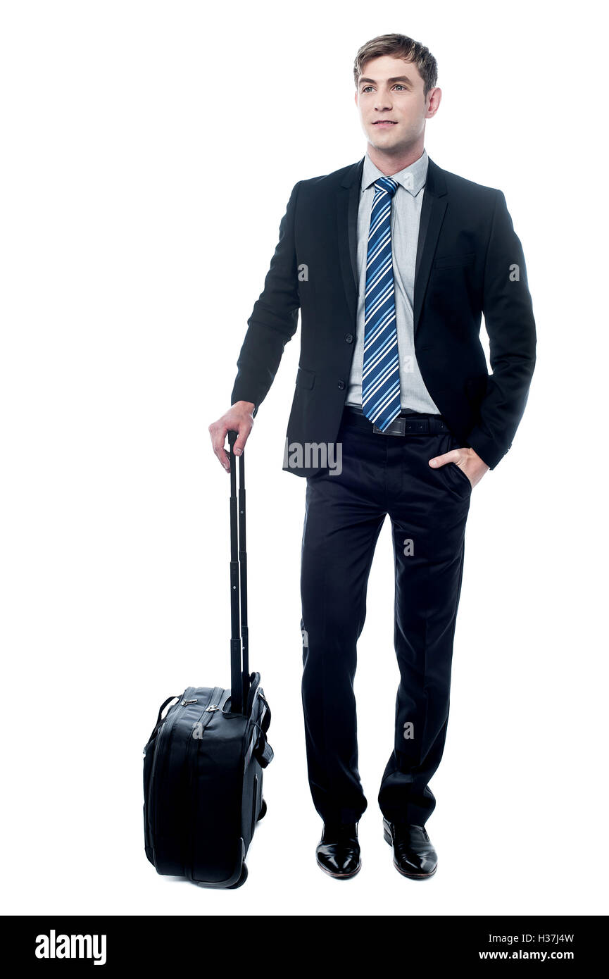 Young business man holding a trolley bag Stock Photo - Alamy