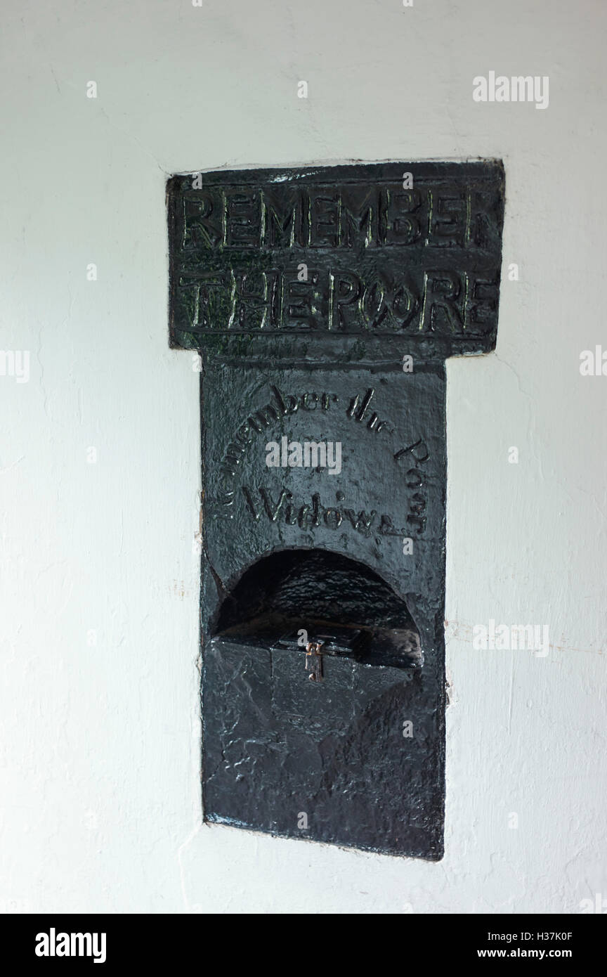 Remember the poor charity box in Kendal Stock Photo - Alamy