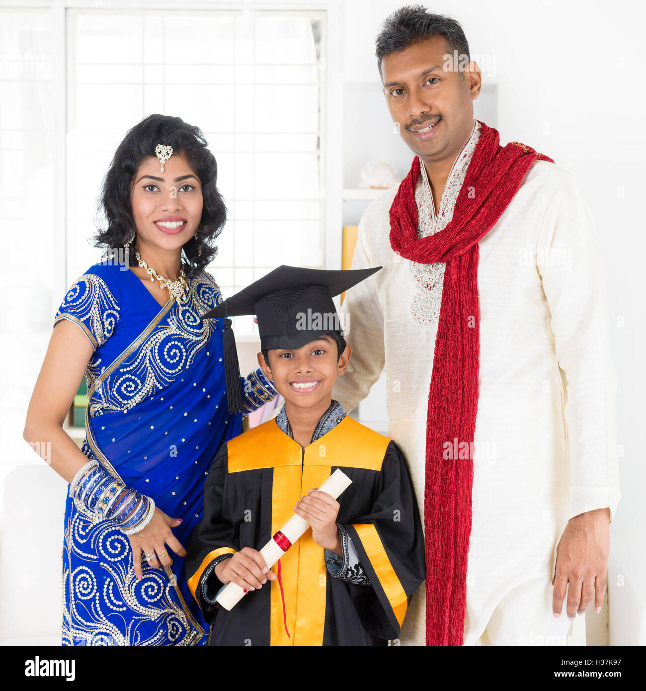 Parents and child on kinder graduate day Stock Photo - Alamy