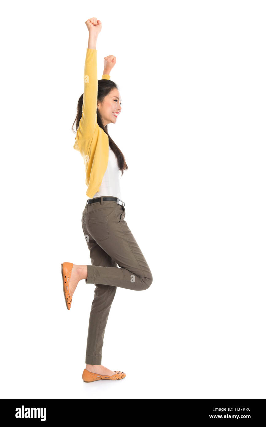 Side view Asian woman jumping Stock Photo - Alamy