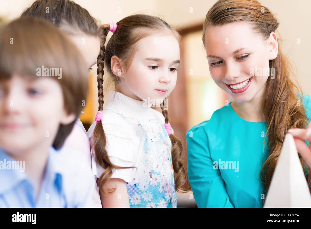 children draw with the teacher Stock Photo - Alamy