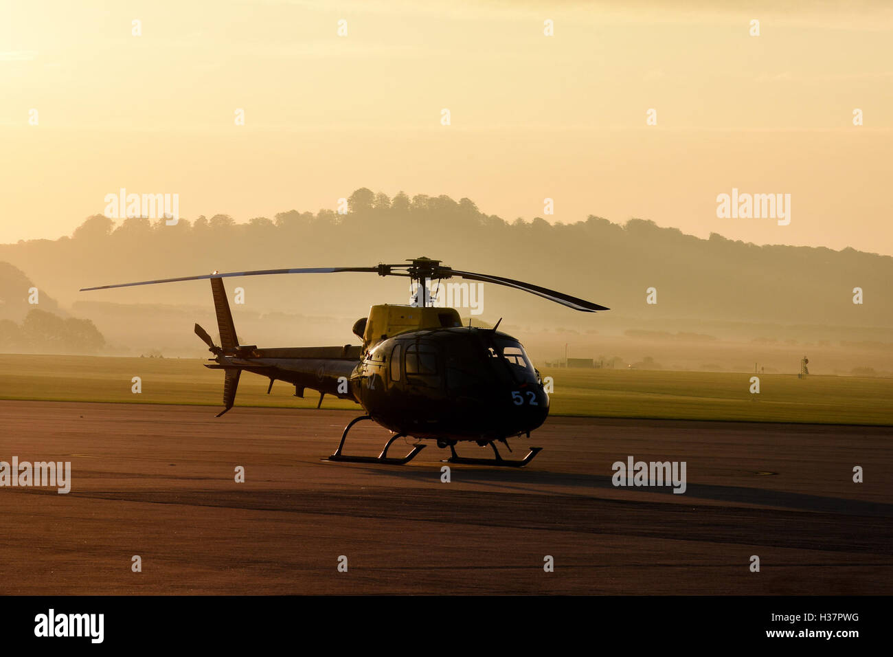 This image captures an Army Air Corps Squirrel Helicopter at dawn ...