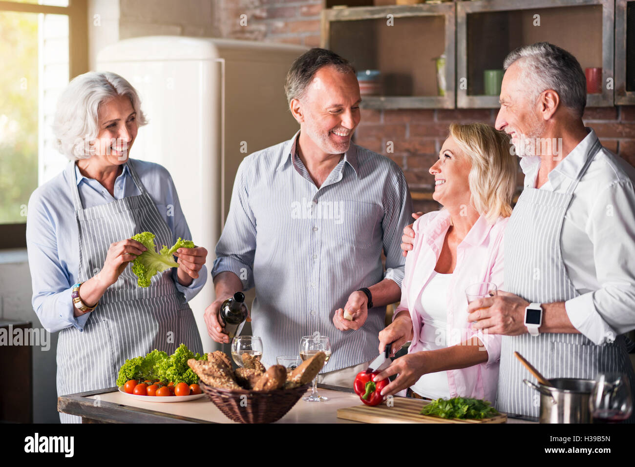 Big family cooking in the kitchen together Stock Photo - Alamy
