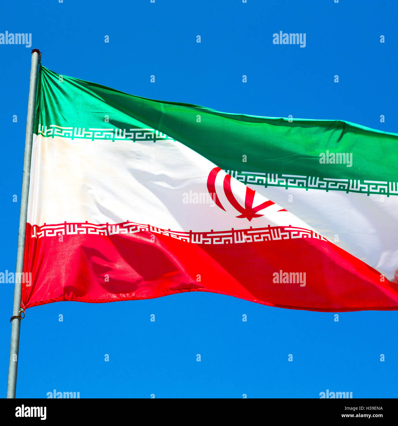 in iran iranian waving flag the blue sky and wind Stock Photo - Alamy
