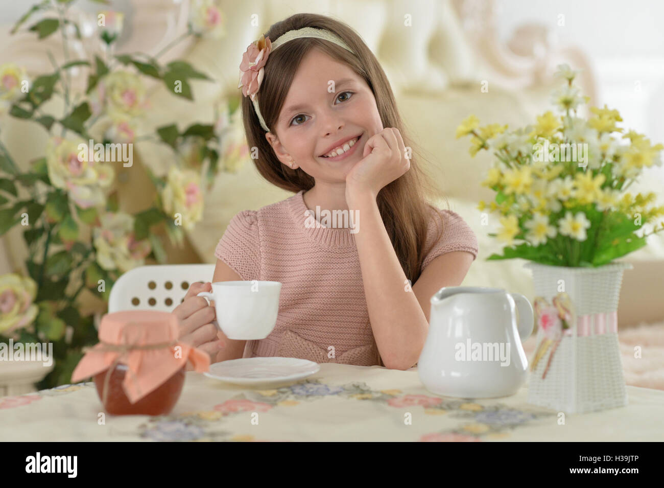 little girl drinking tea Stock Photo - Alamy