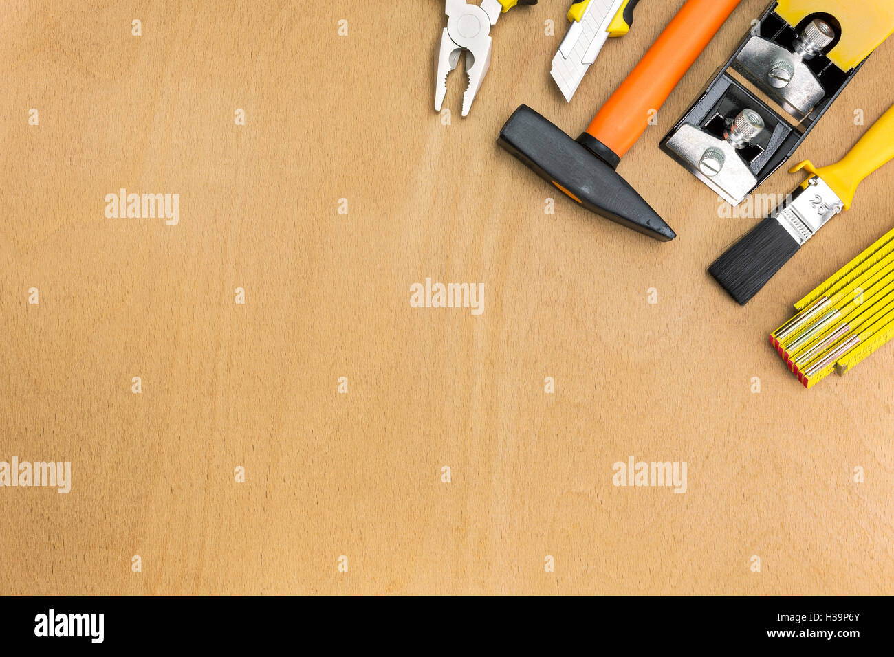 Workbench with different tools on wooden background Stock Photo - Alamy