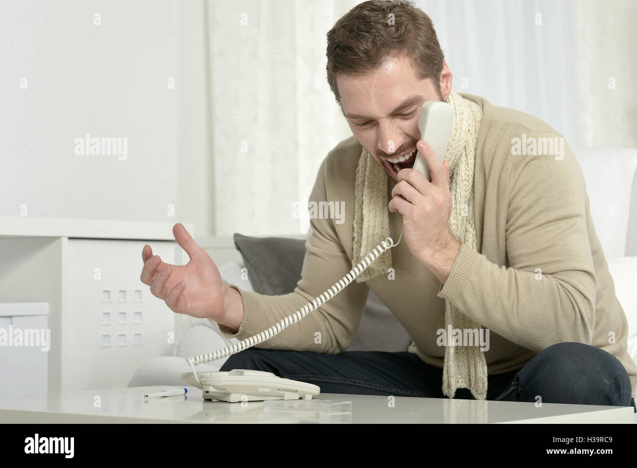 sick man calling his doctor Stock Photo - Alamy