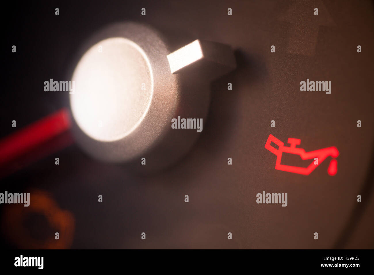 Detail of the dashboard of a car, with the oil alert icon lit up Stock ...