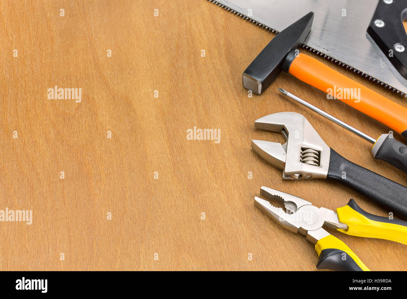 Workbench with different tools on wooden background Stock Photo - Alamy