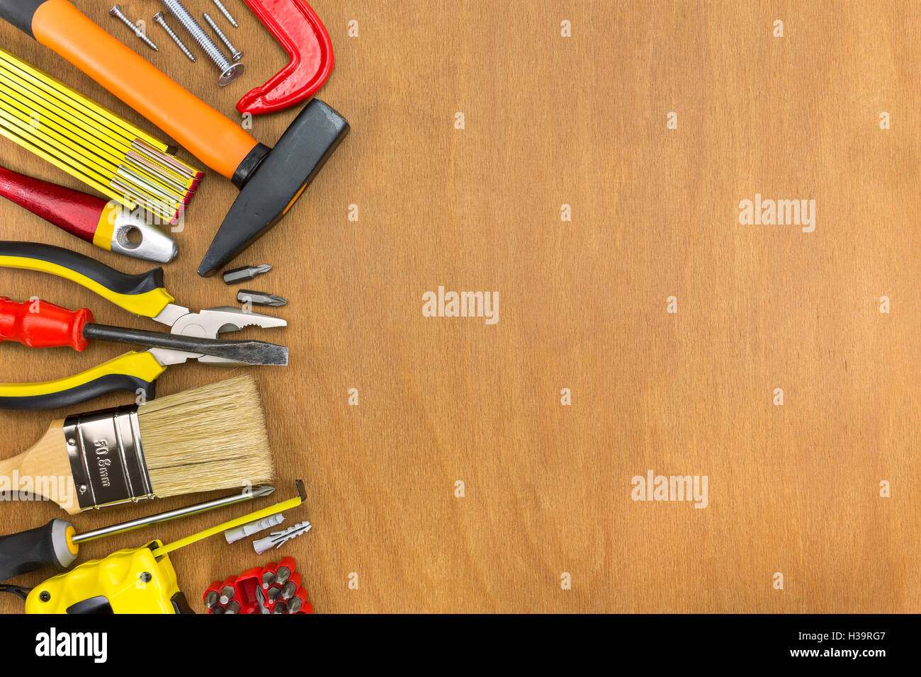 Workbench with different tools on wooden background Stock Photo - Alamy