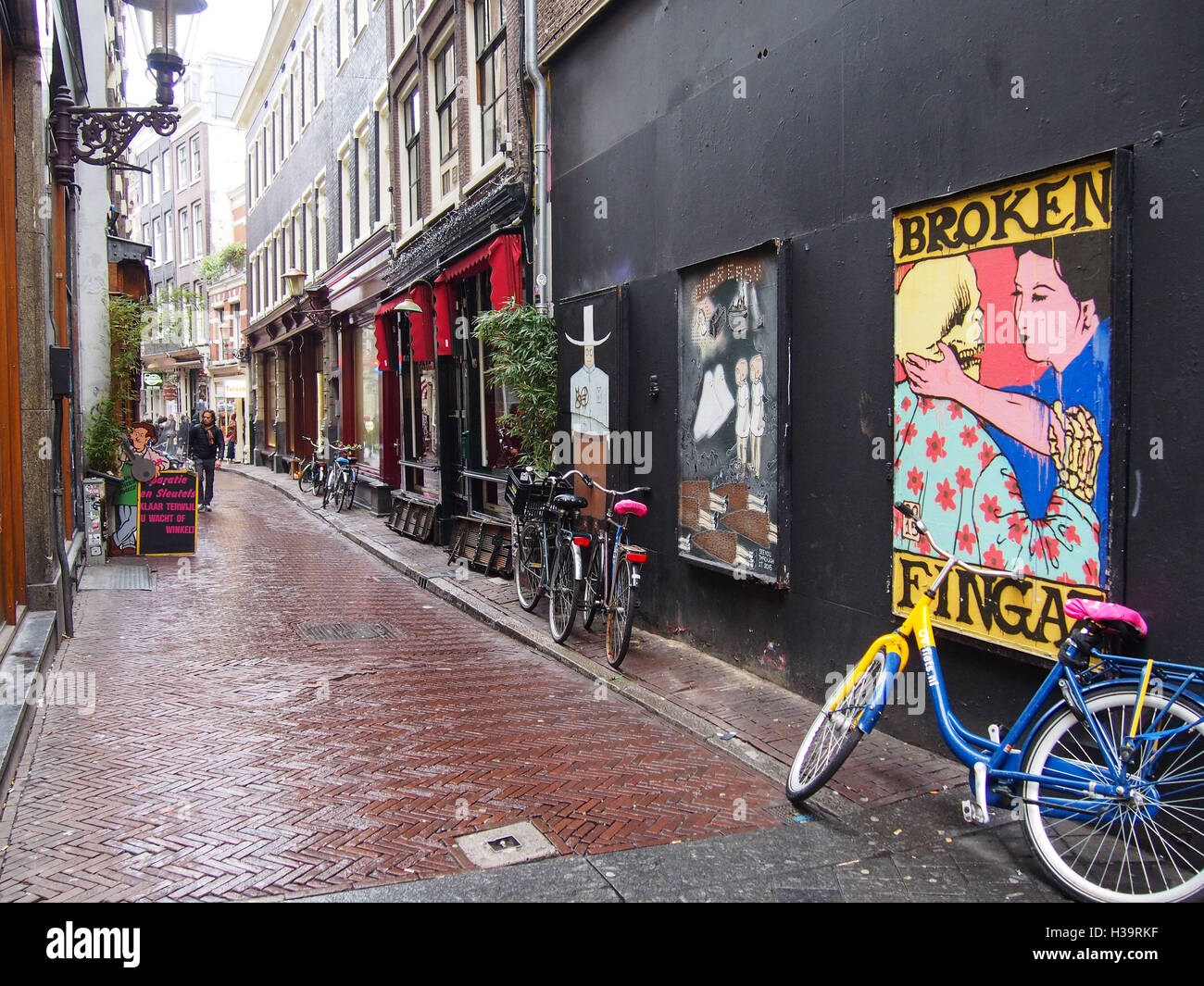 Shops in a long and narrow street in Amsterdam Stock Photo - Alamy