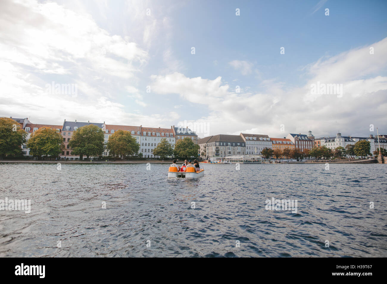 Group of friends sitting outdoors lake hi-res stock photography and ...