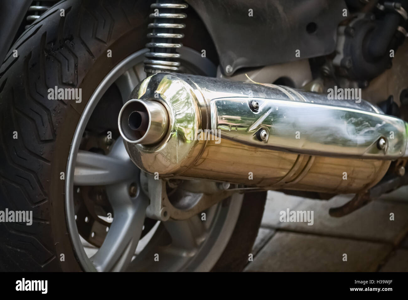 Closeup of an exhaust of a motorbike on the street Stock Photo - Alamy