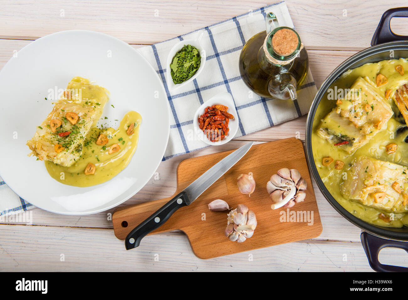 Salt cod in a pilpil sauce a typical Spanish recipe Stock Photo - Alamy