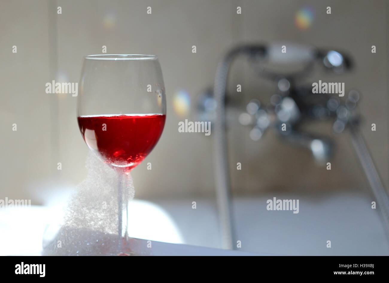 Luxury bath with a glass of wine Stock Photo - Alamy