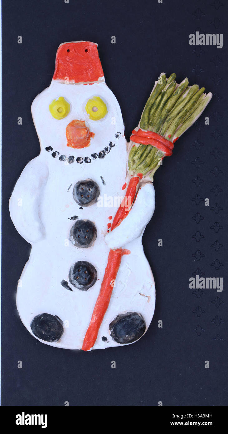 snowman. crafts from clay. children creativity. black background, clay ...