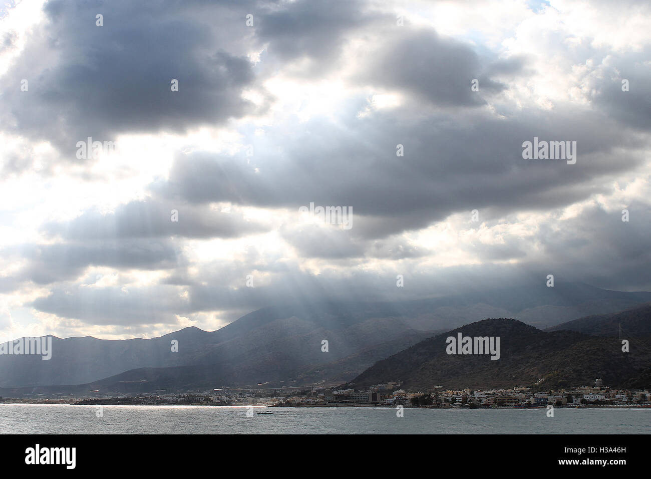 Sun rays beam down on Stalis Stalida Crete Greece Stock Photo - Alamy