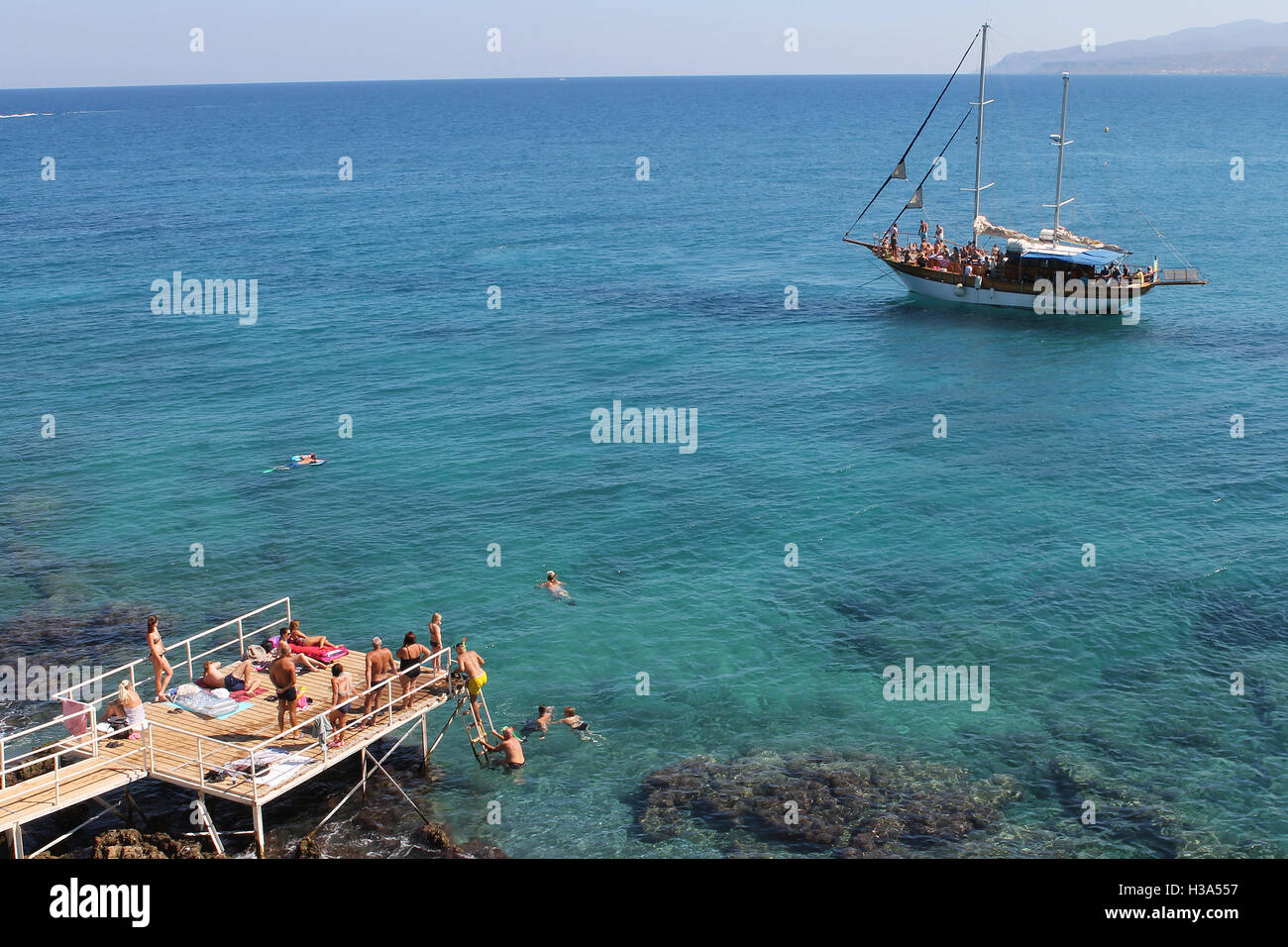 Jetty off the coast of Stalida, Stalis Crete Greece Stock Photo - Alamy