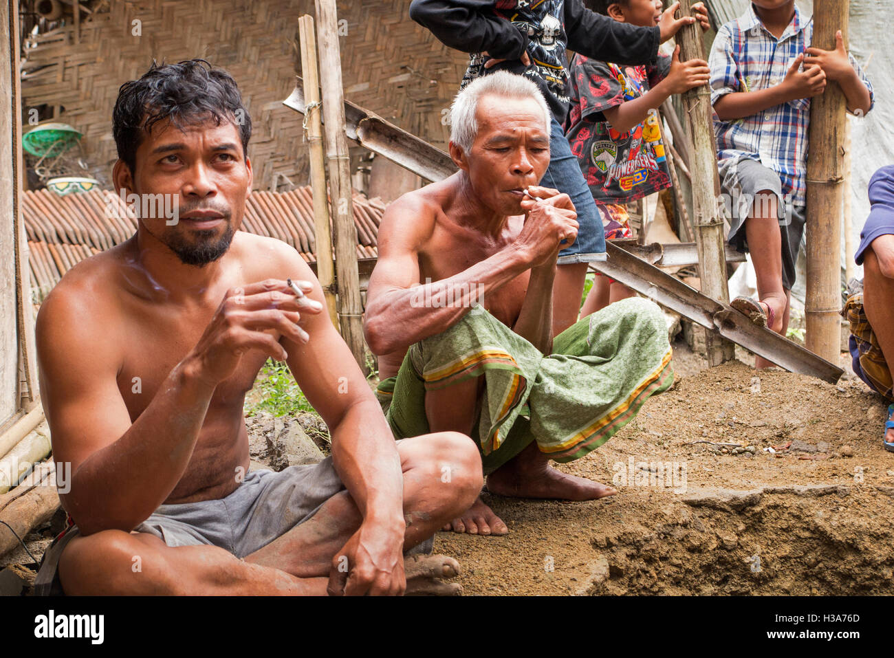 Indonesia, Lombok, Mantang, workers digging rural village well resting ...