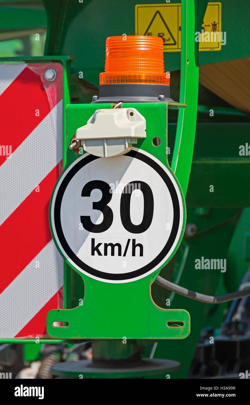 Illuminated signal speed limit posted on back of tractor Stock Photo ...