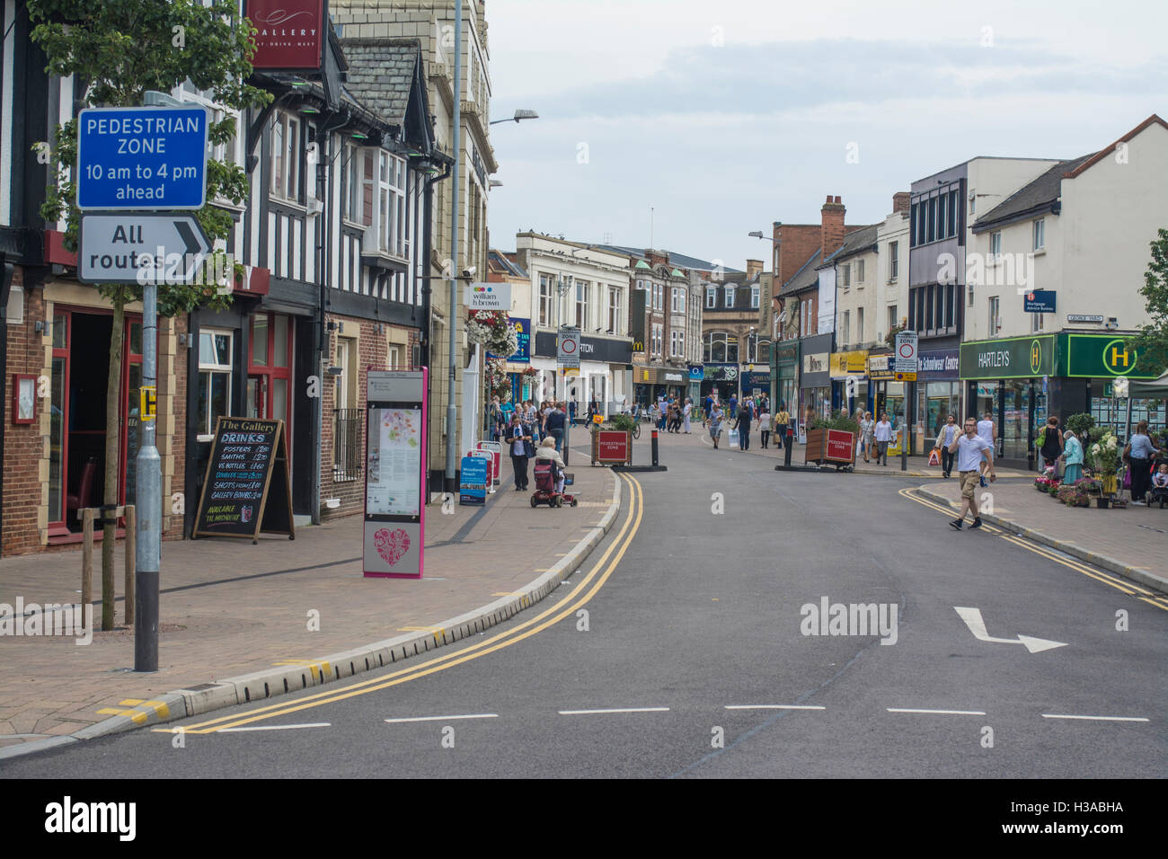 Signpost pointing to the pedestrianised area of Loughborough town ...