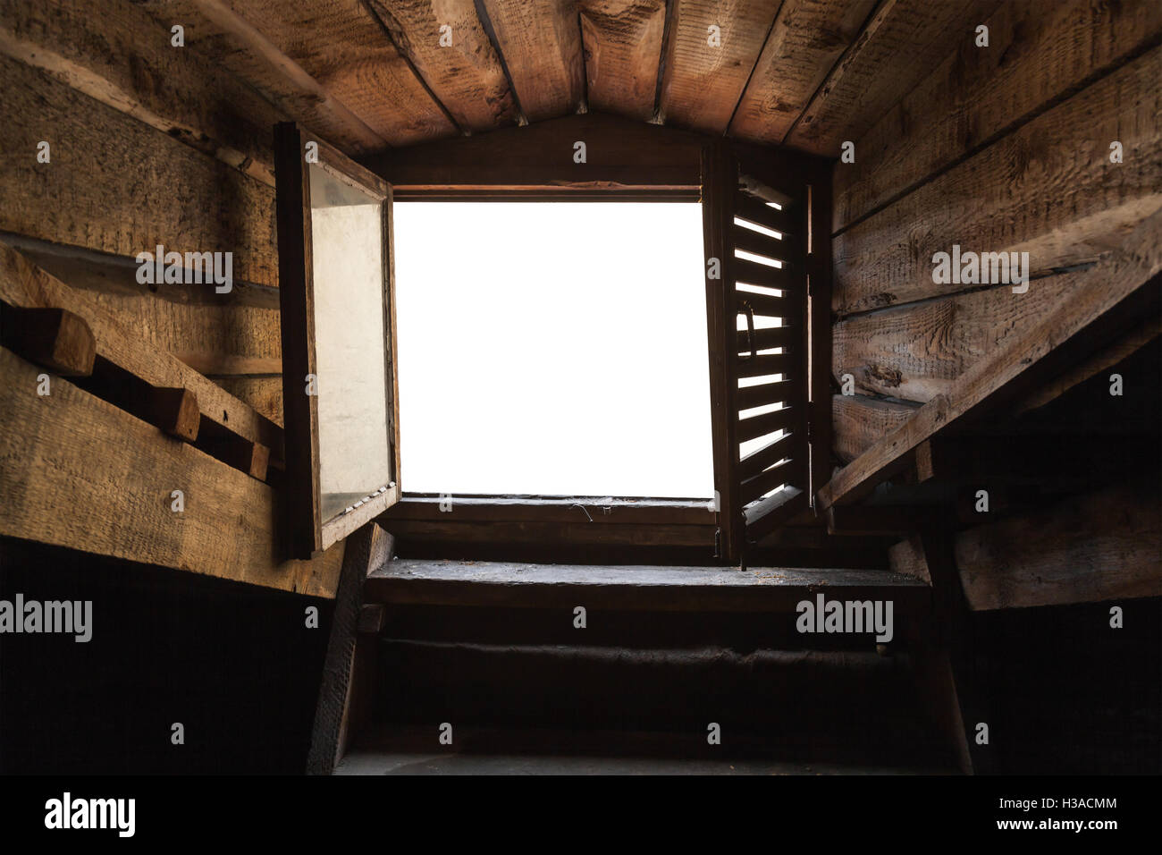 Empty attic window with white background in old grunge wooden interior ...