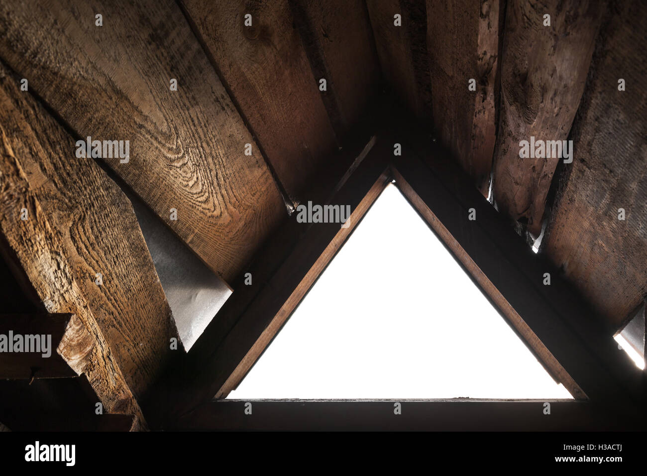 Empty triangle window with white background in old grunge wooden ...