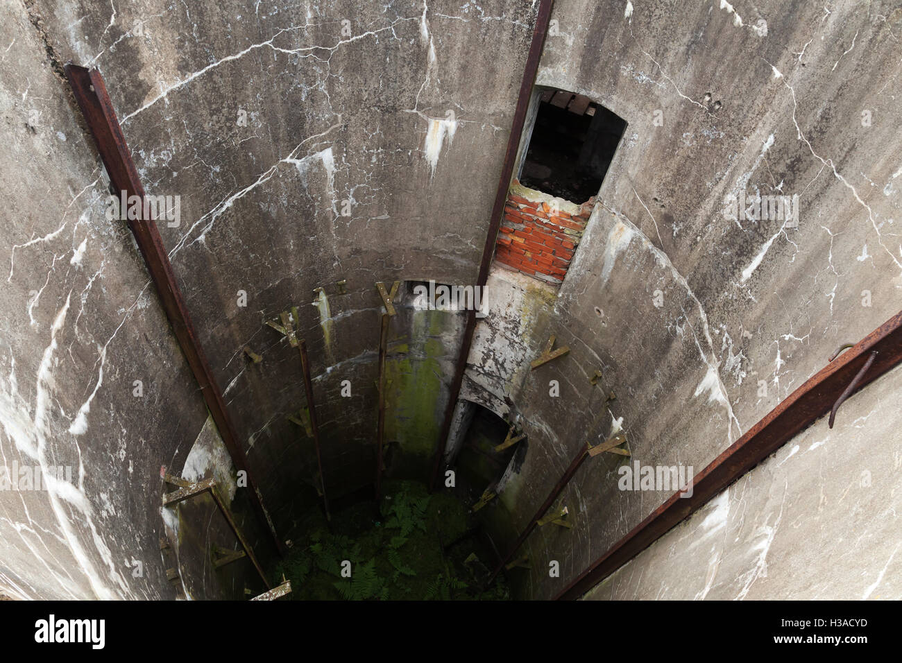 Abandoned military silo. Grunge concrete tunnel interior Stock Photo ...