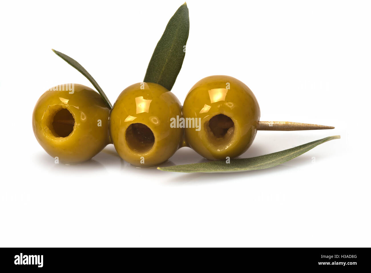 Three olives on a toothpick isolated on a white background Stock Photo ...