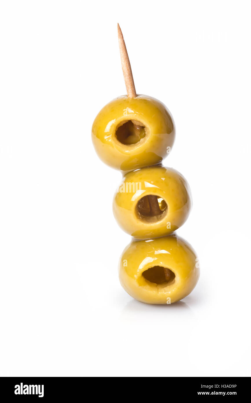 Three olives on a toothpick isolated on a white background Stock Photo ...