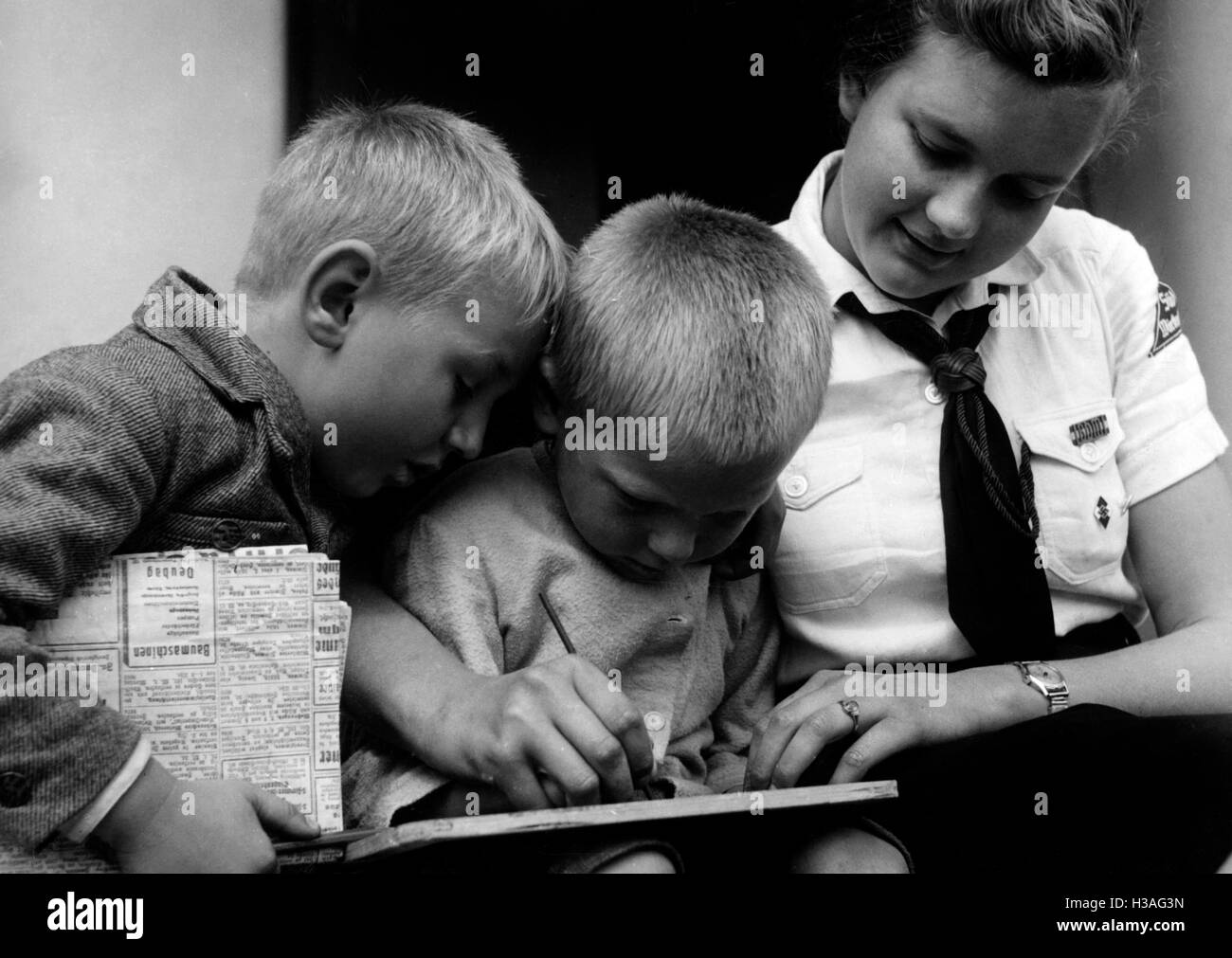 Jungmaedel with peasant children, 1940 Stock Photo - Alamy