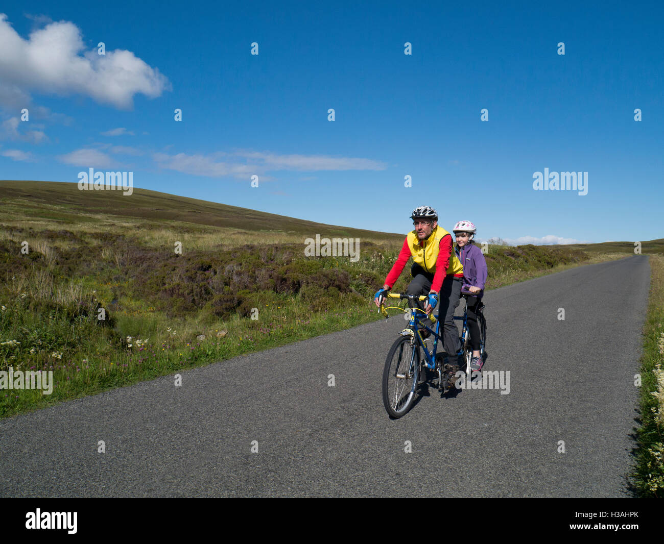 Tandem bike with children hi-res stock photography and images - Alamy
