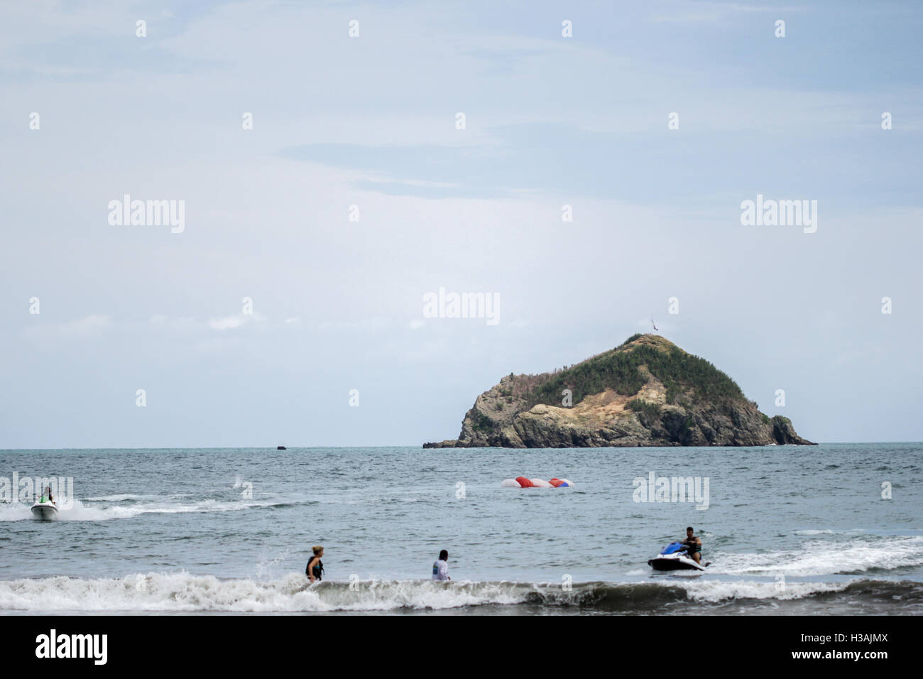 ROcks inside the blue ocean Stock Photo - Alamy
