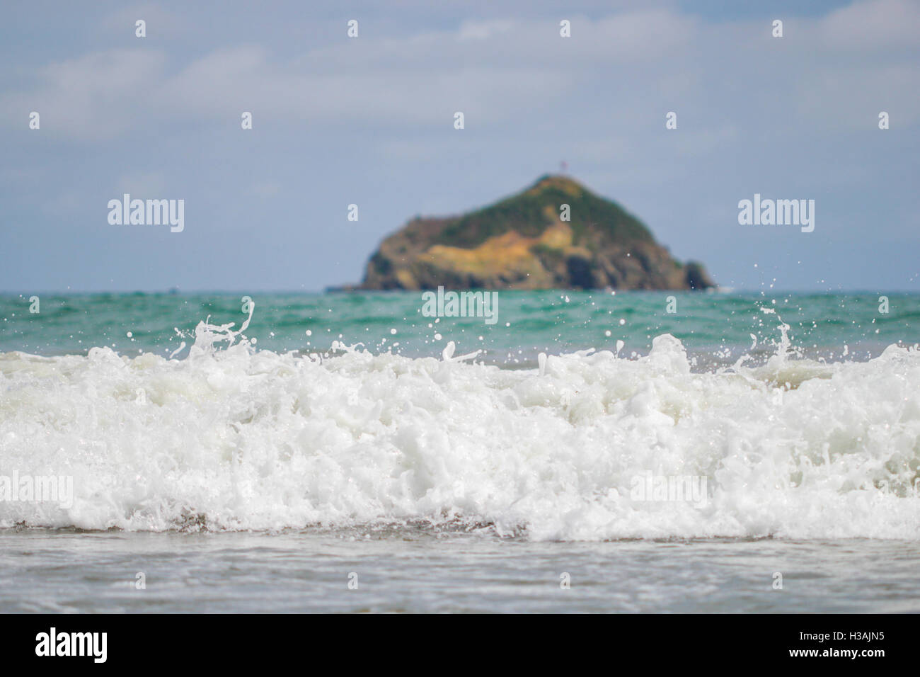 ROcks inside the blue ocean Stock Photo - Alamy