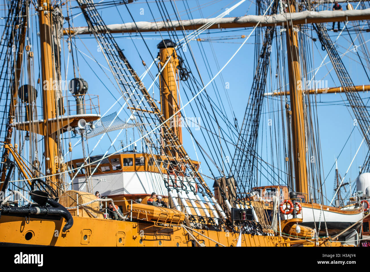 Beautiful tall wooden antique war ship at the harbor loading and ...